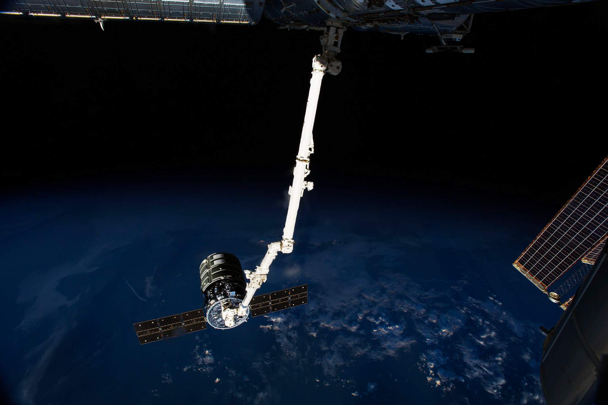 The International Space Station’s Canadarm2 prepares to release ... The International Space Station’s Canadarm2 prepares to release ...